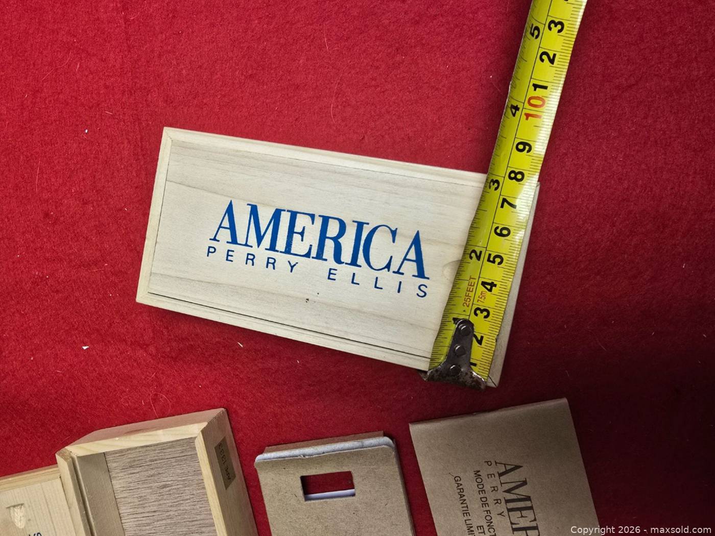 70 Perry Ellis America wooden slide-top boxes | Maxsold