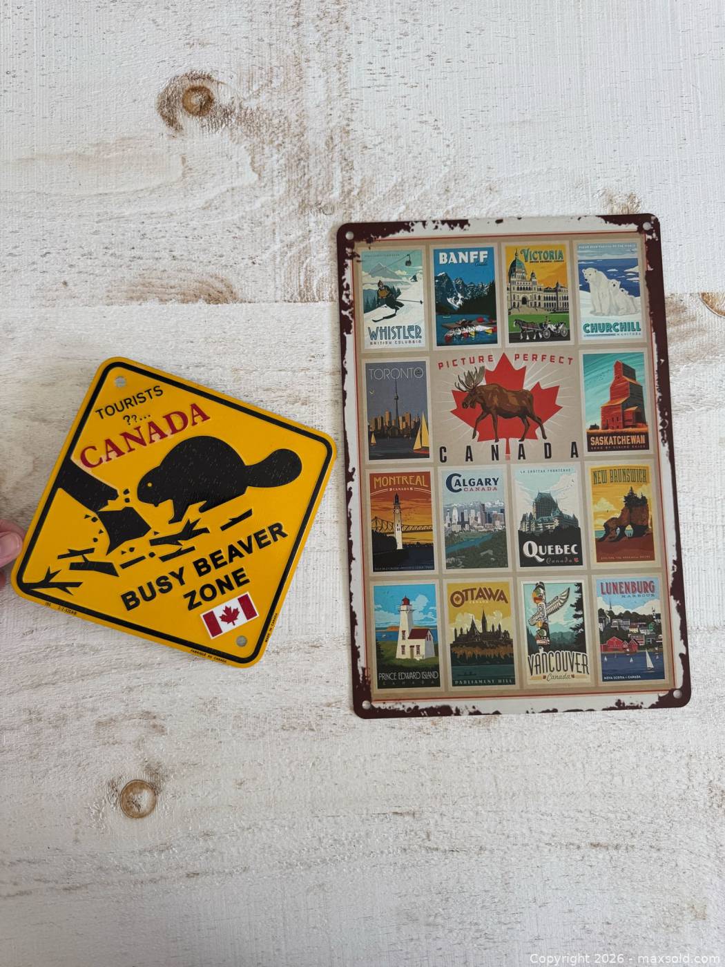 Two Canada metal novelty tourist signs | Maxsold