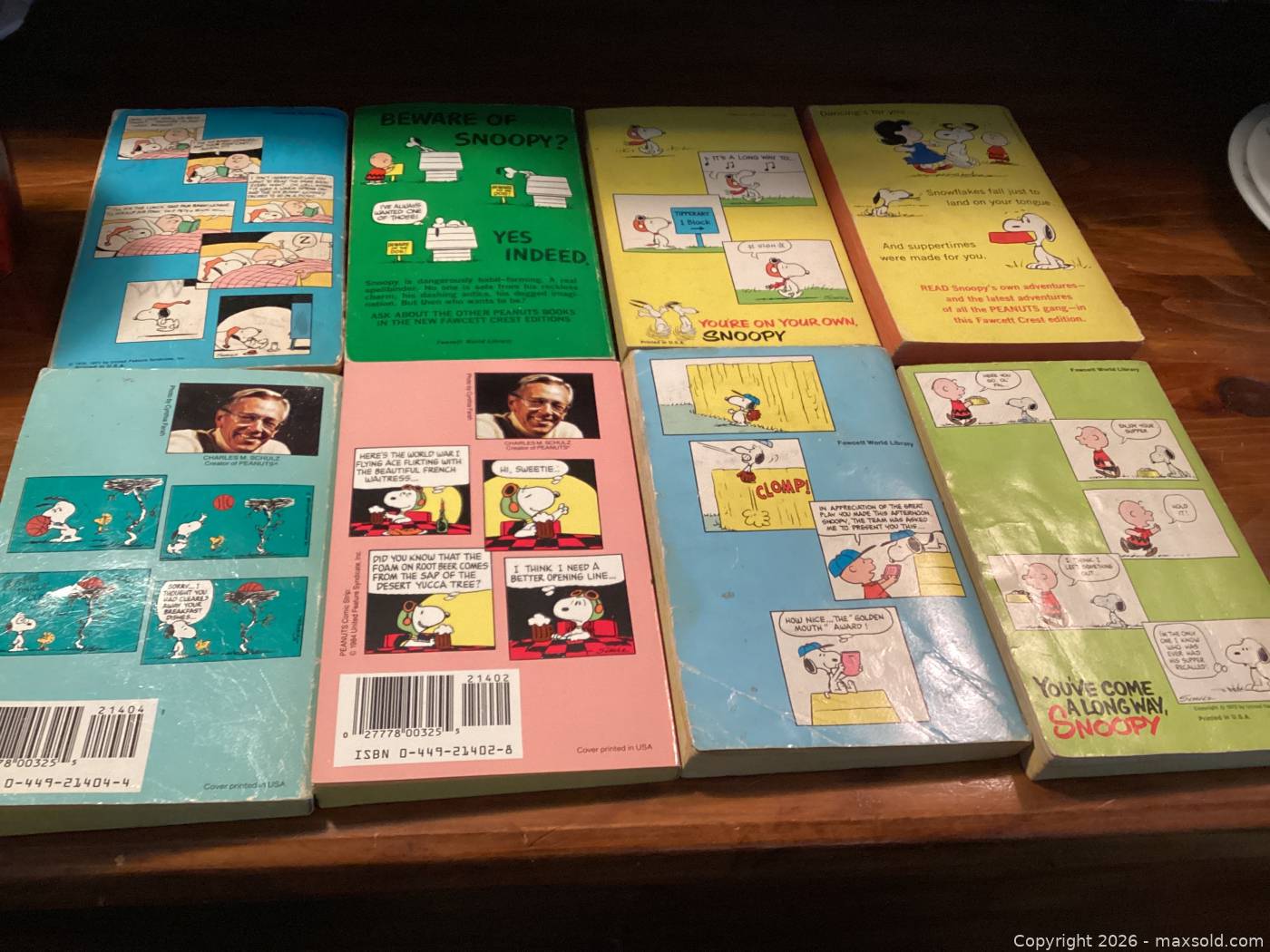 8 Peanuts Snoopy cartoon paperback books | Maxsold