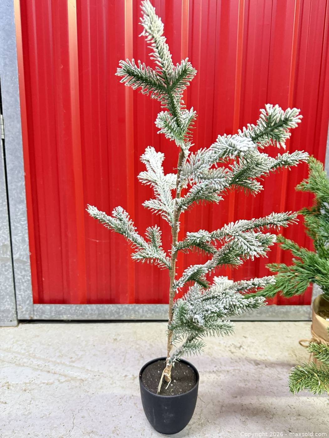 Four tabletop faux evergreen trees | Maxsold