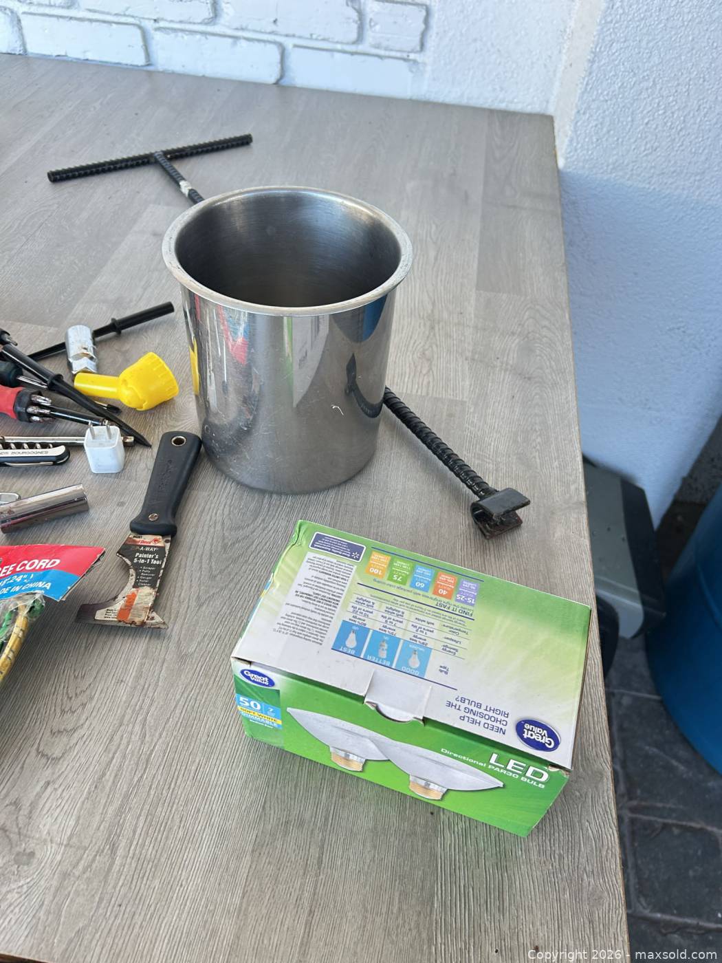 Assorted hand tools, power strips, bungee cords and LED light | Maxsold