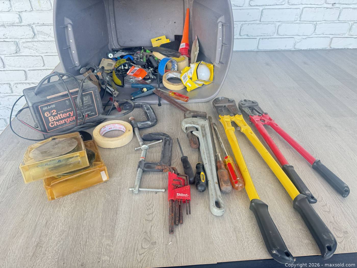 Misc hand tools with bolt cutters and charger | Maxsold
