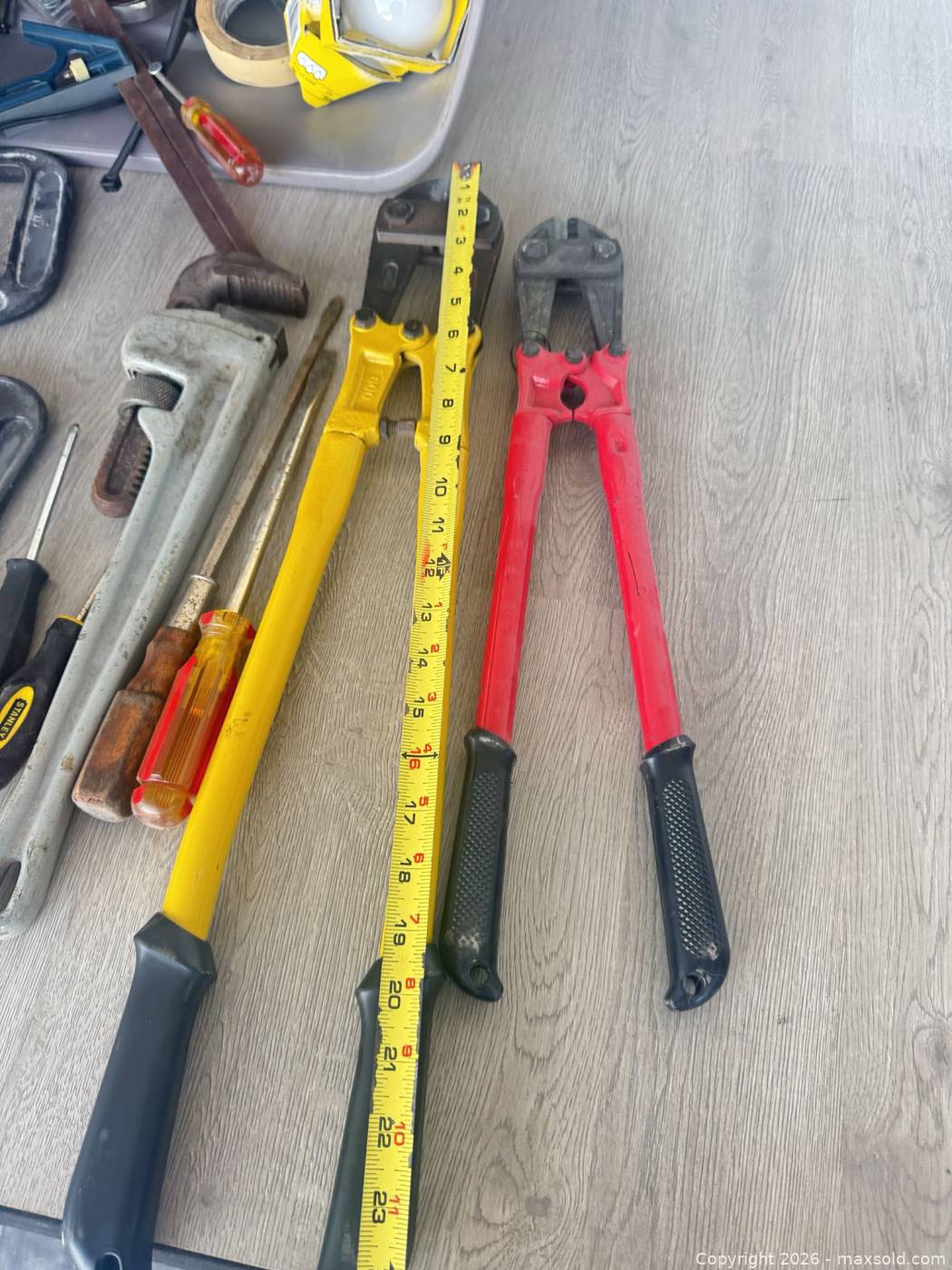Misc hand tools with bolt cutters and charger | Maxsold