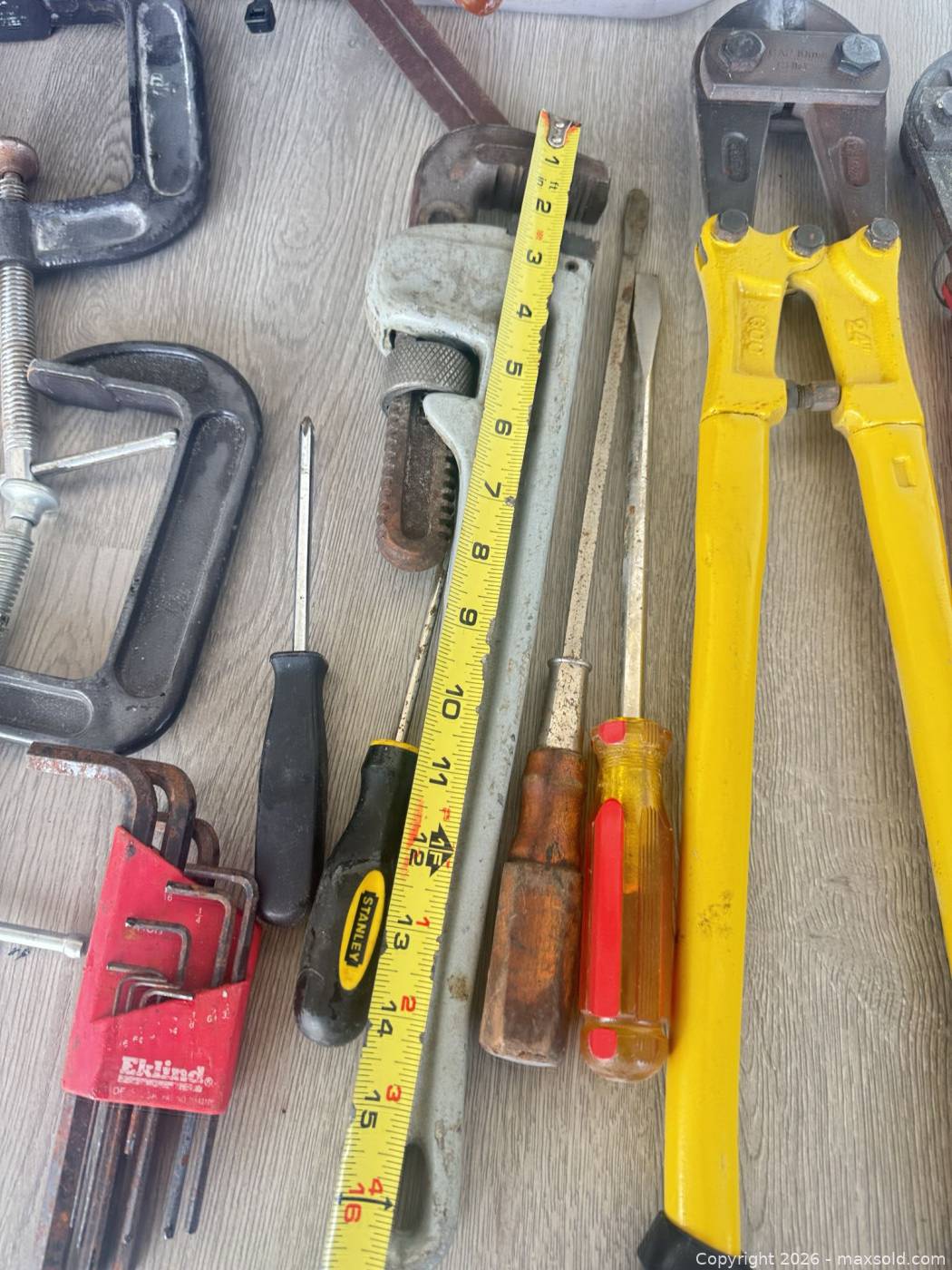 Misc hand tools with bolt cutters and charger | Maxsold