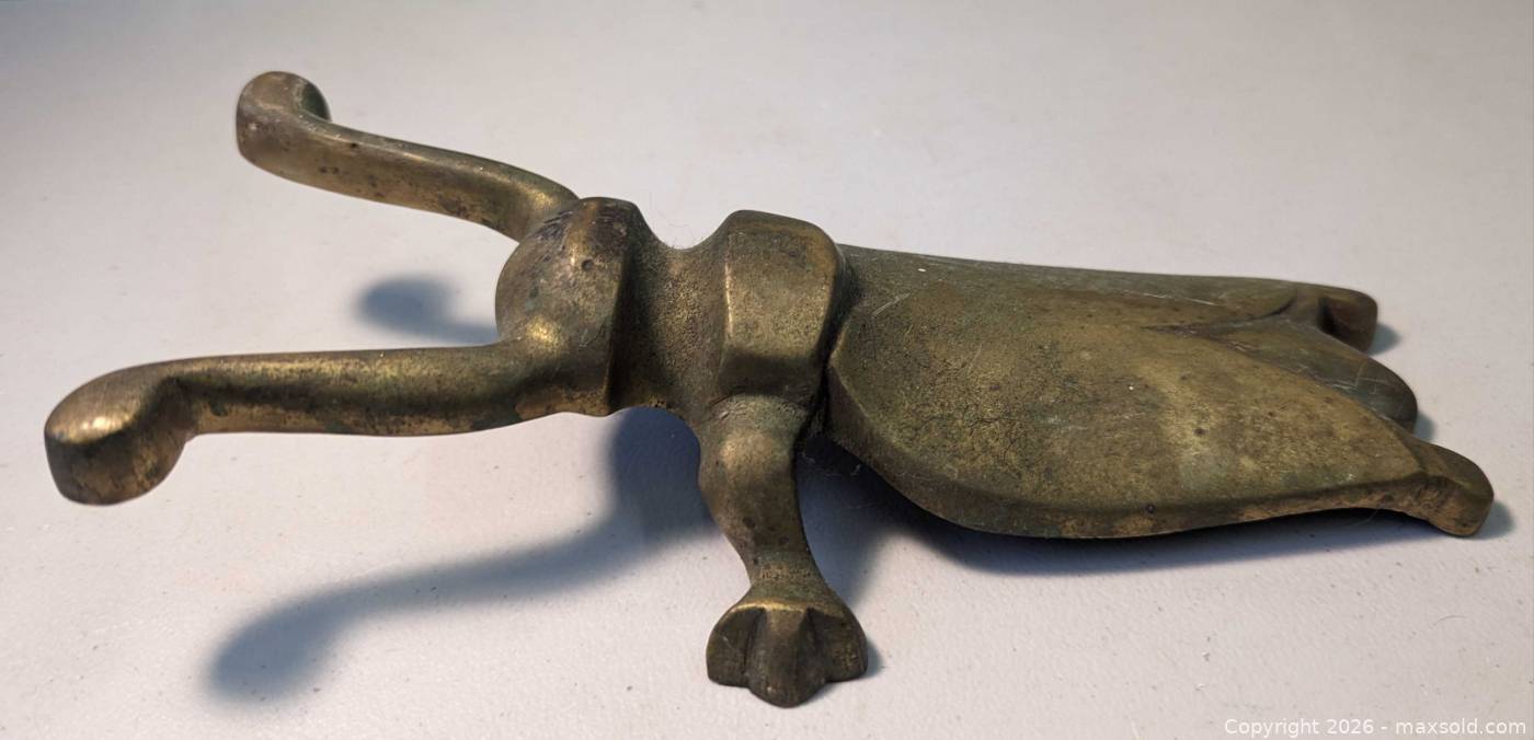 Antique brass horned insect boot scrape door stop | Maxsold