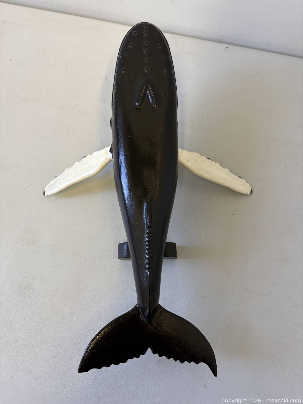 Carved wood humpback whale sculpture on plinth | Maxsold