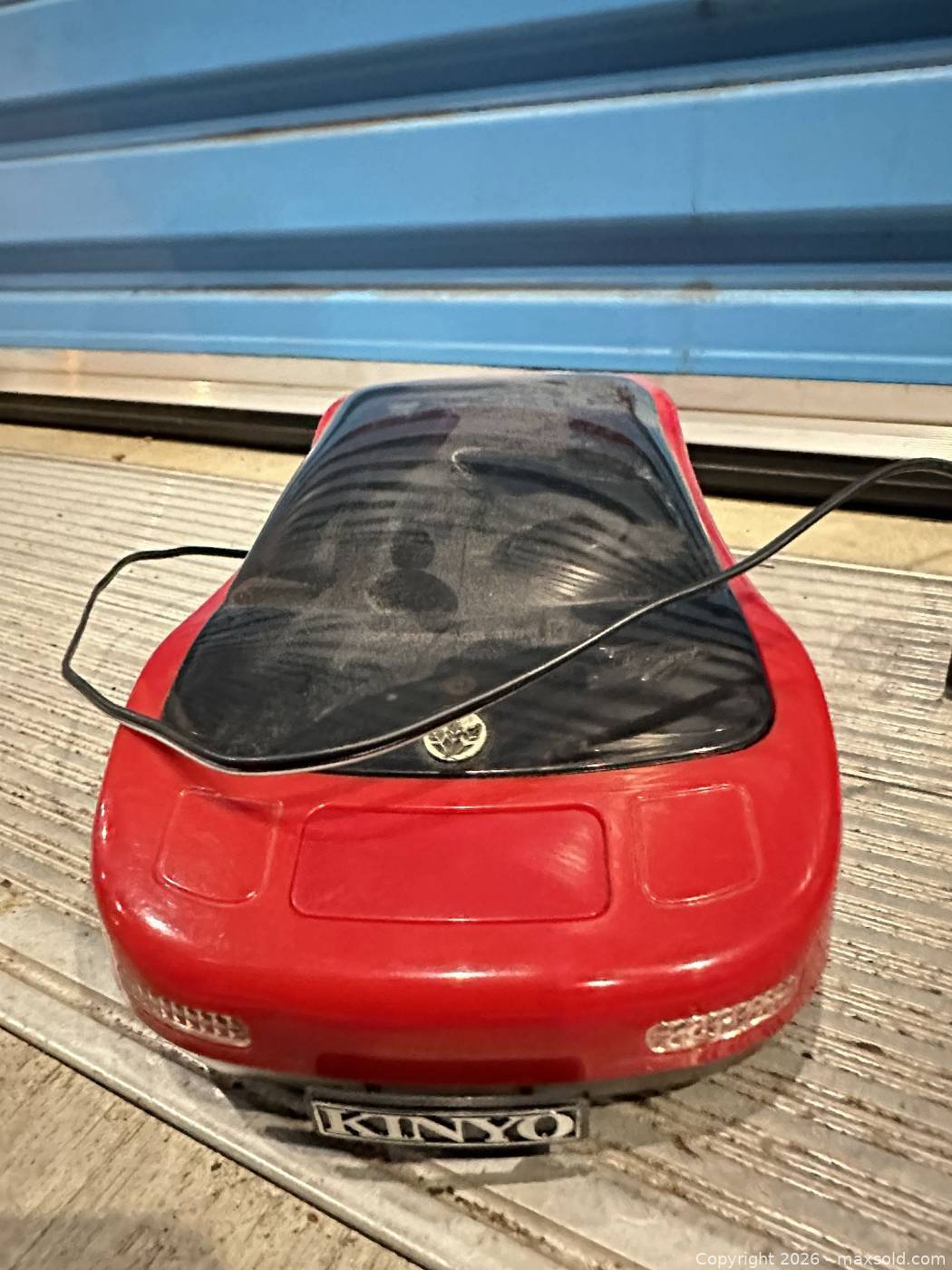 Kinyo red car VHS cassette rewinder with AC adapter | Maxsold