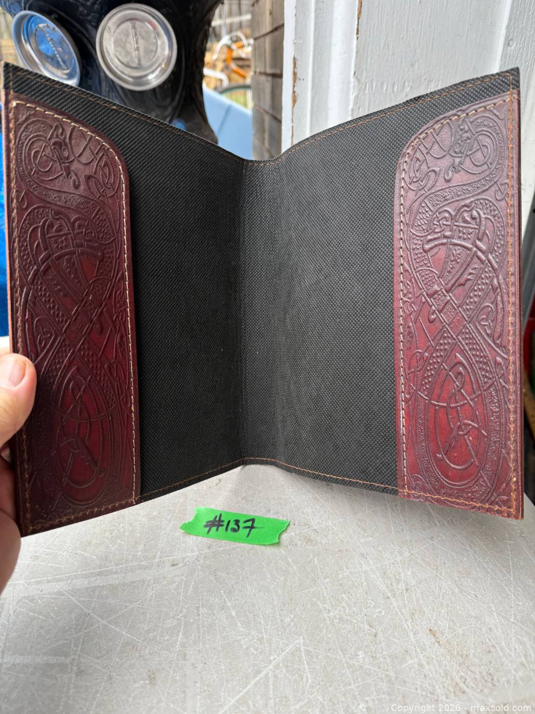 Vintage embossed leather book cover | Maxsold