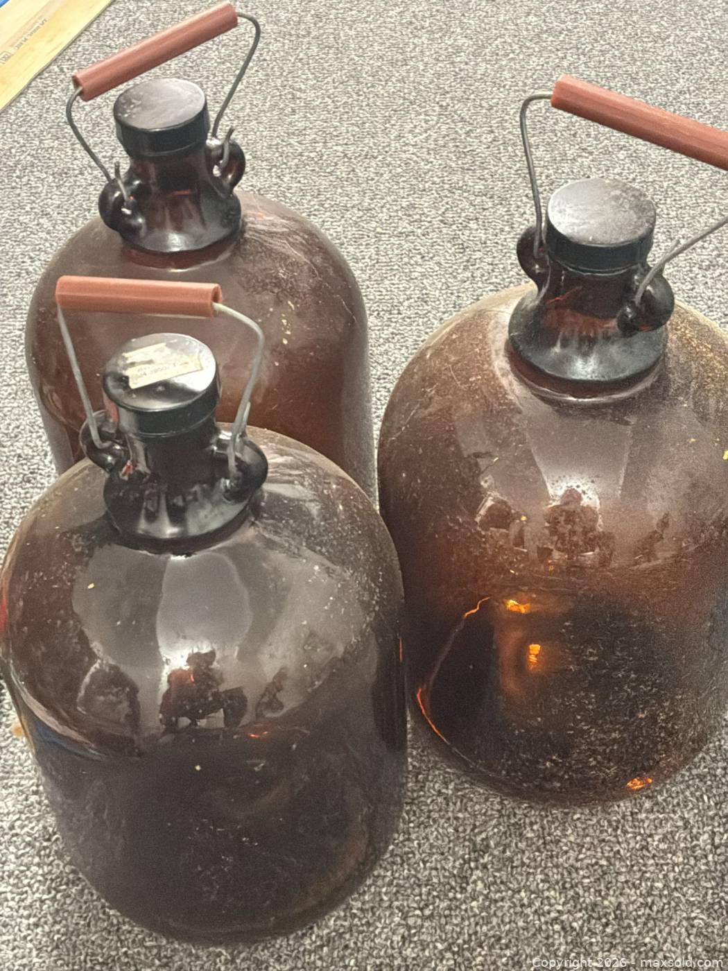 Amber glass carboy jugs with caps and handles | Maxsold