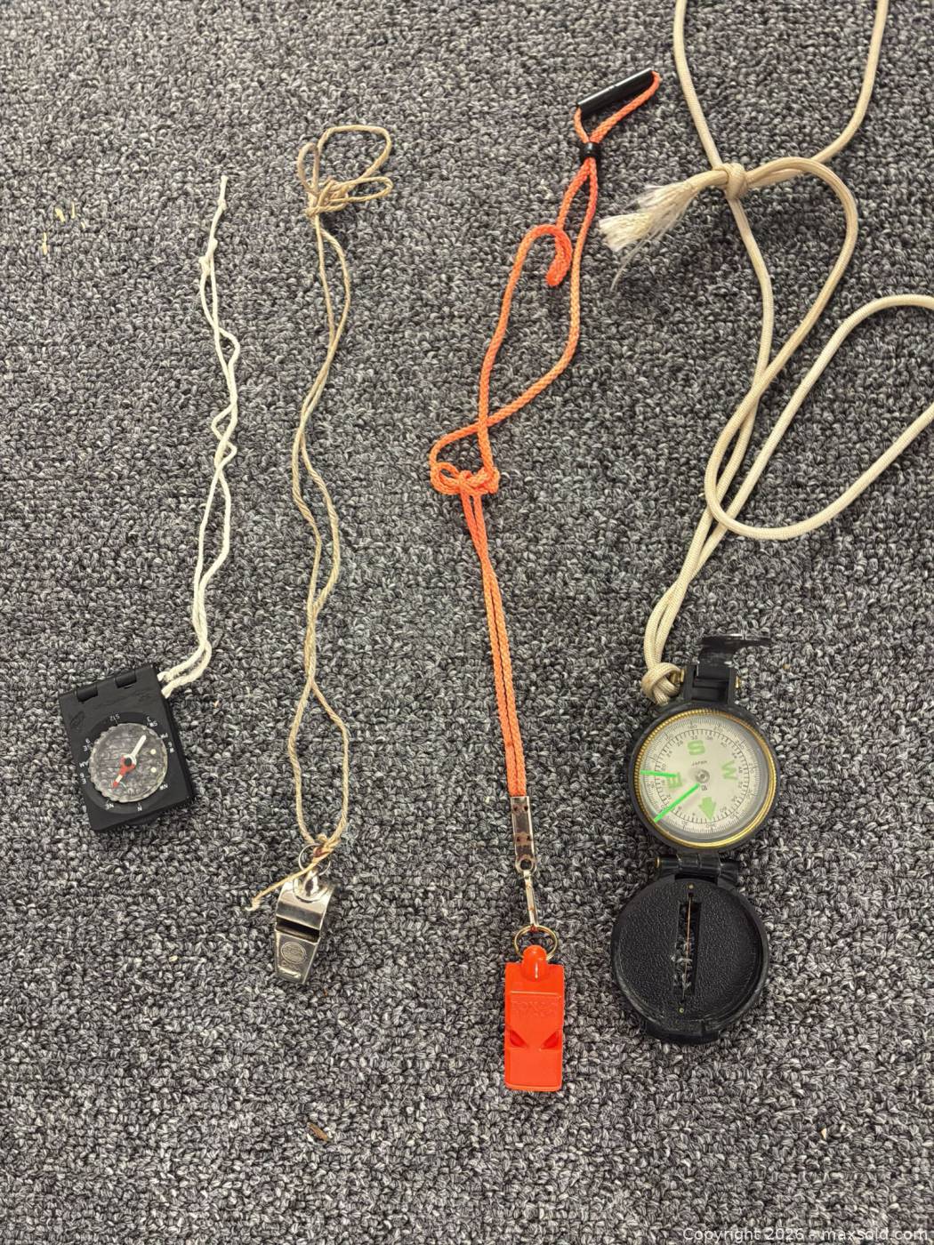 4 Compasses And Whistles On Lanyards | Maxsold