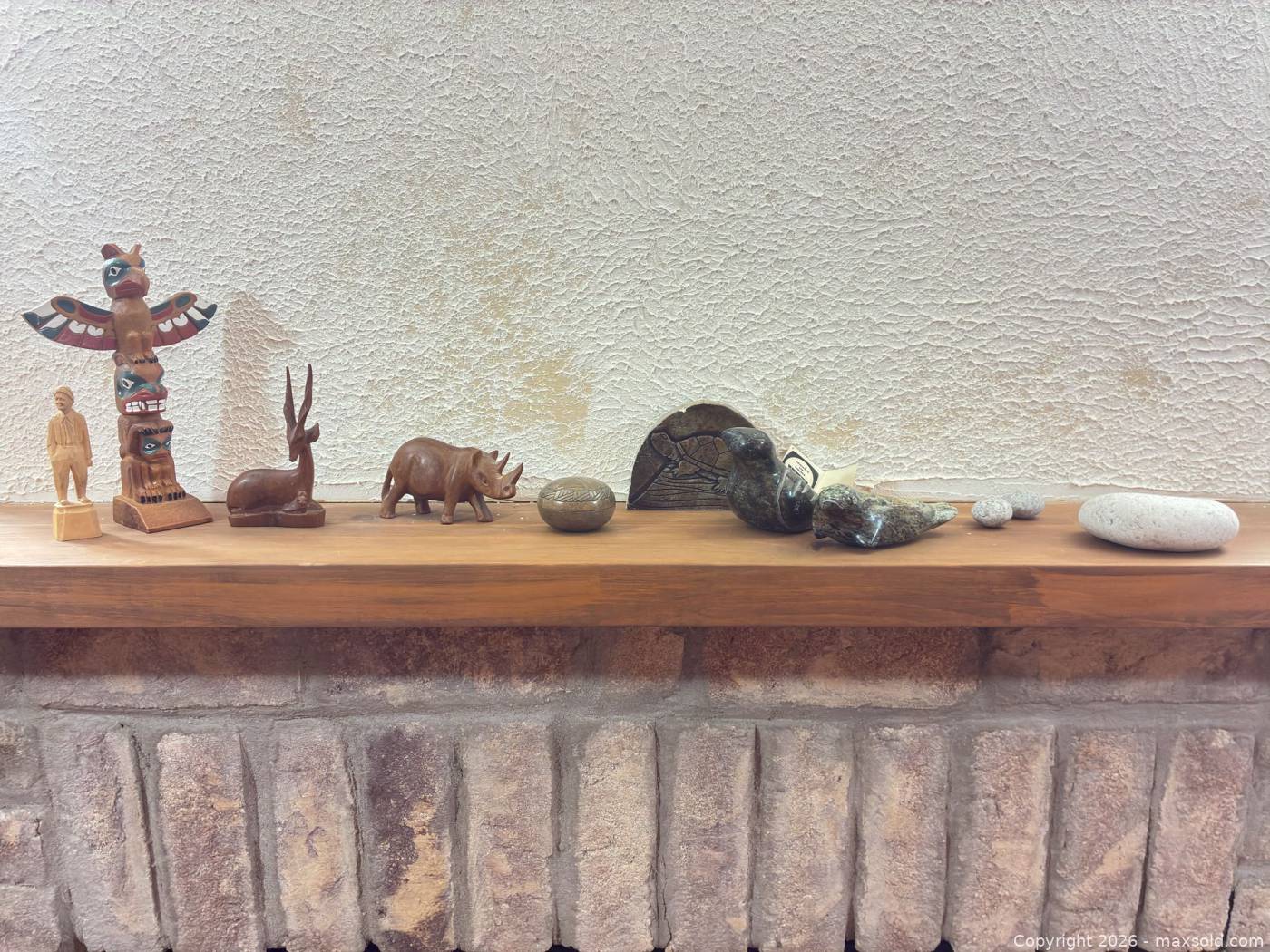 Mixed carved wood, stone and bronze figurines, trinket box and river ...