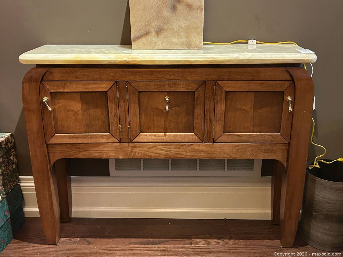 Wood console cupboard with alabaster top | Maxsold