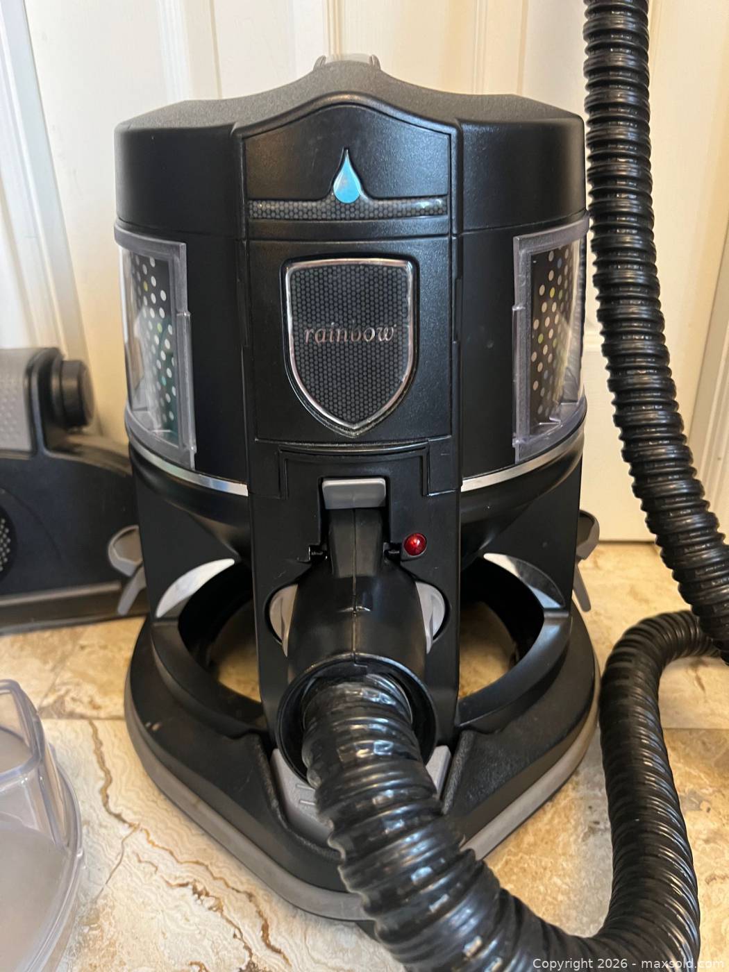 Rainbow E2 black canister vacuum with accessories | Maxsold