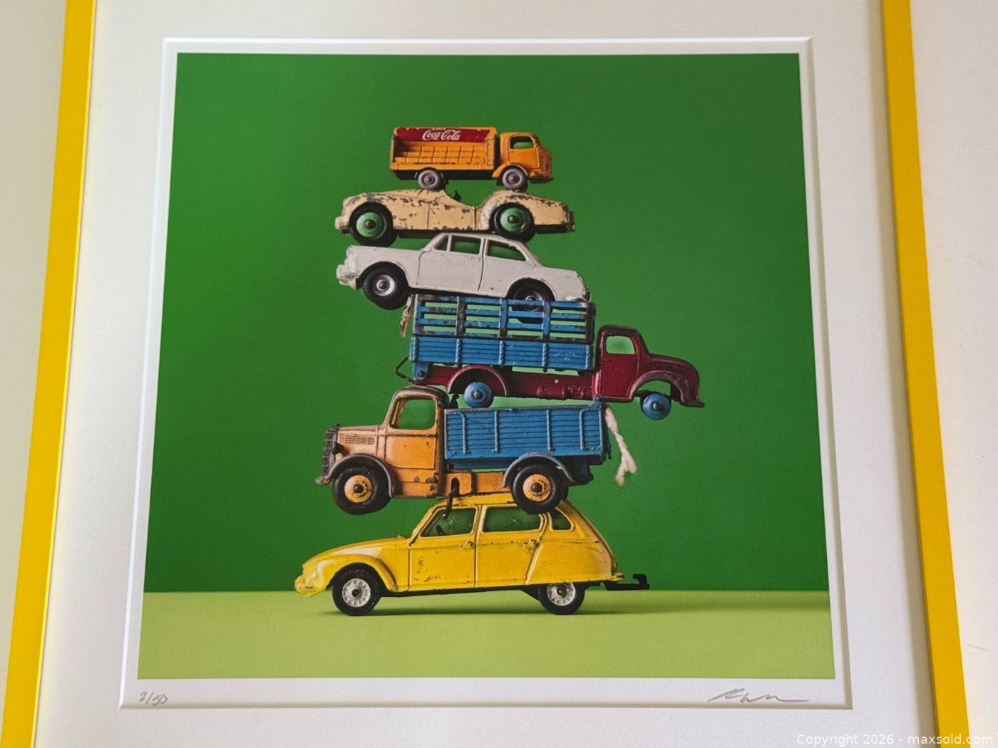 Signed Becca Wallace stacked toy cars photo | Maxsold
