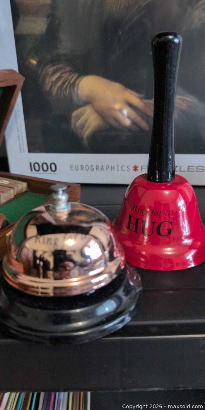 Sealed Mona Lisa puzzle, sealed cards, dice cup, two bells | Maxsold