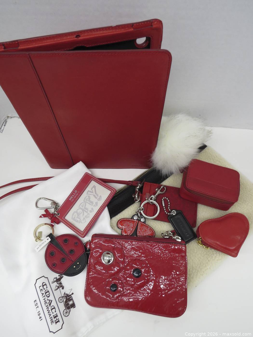 Coach red leather tablet folio, pouches & charms | Maxsold