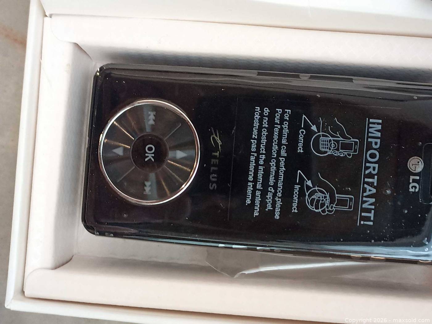 Vintage LG Telus feature phone in factory packaging | Maxsold