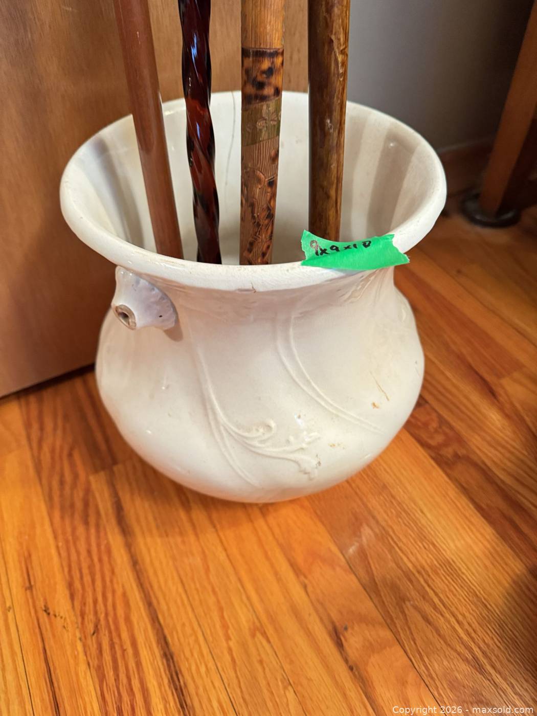 4 Wooden Walking Canes & Ceramic Stand | Maxsold