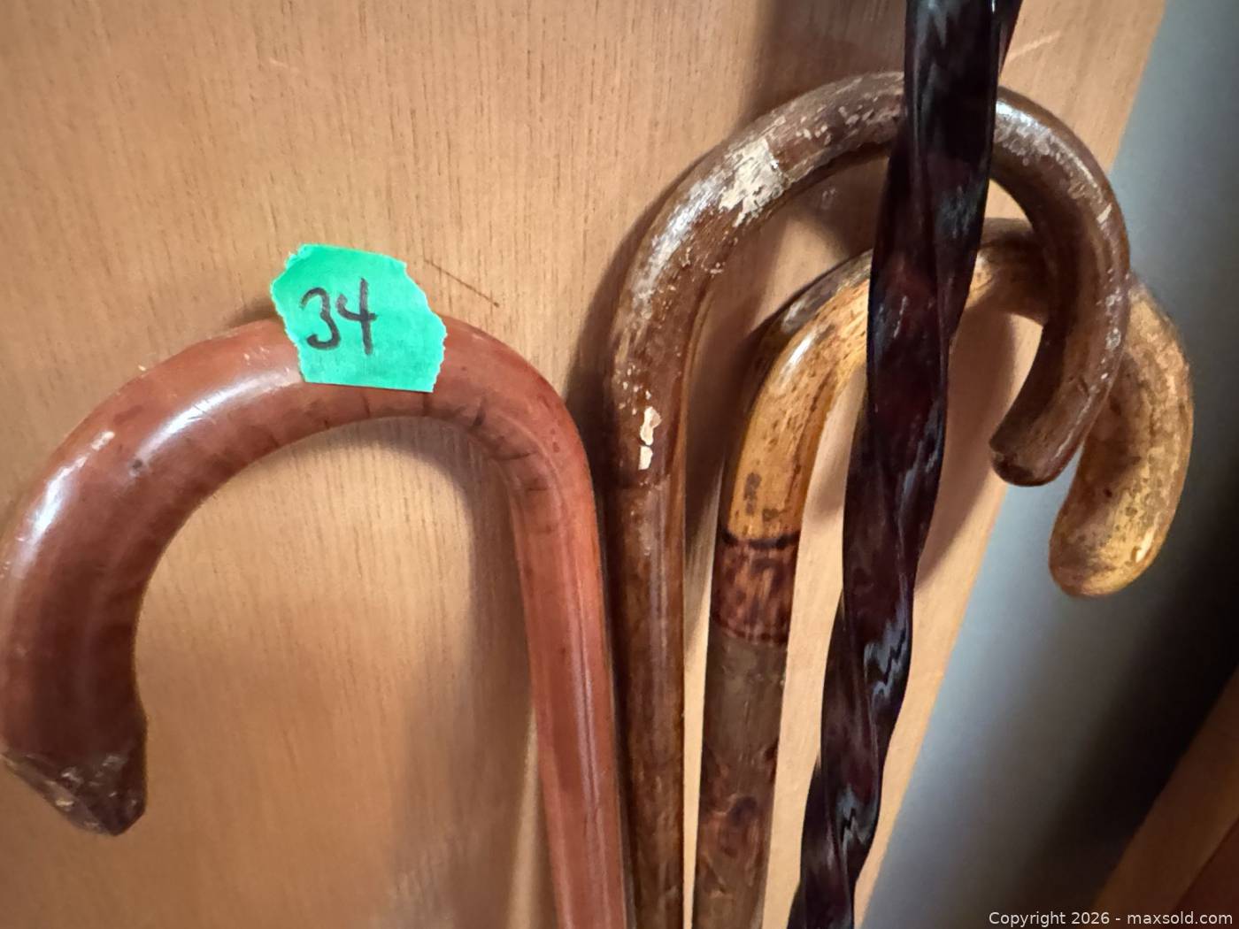 4 Wooden Walking Canes & Ceramic Stand | Maxsold