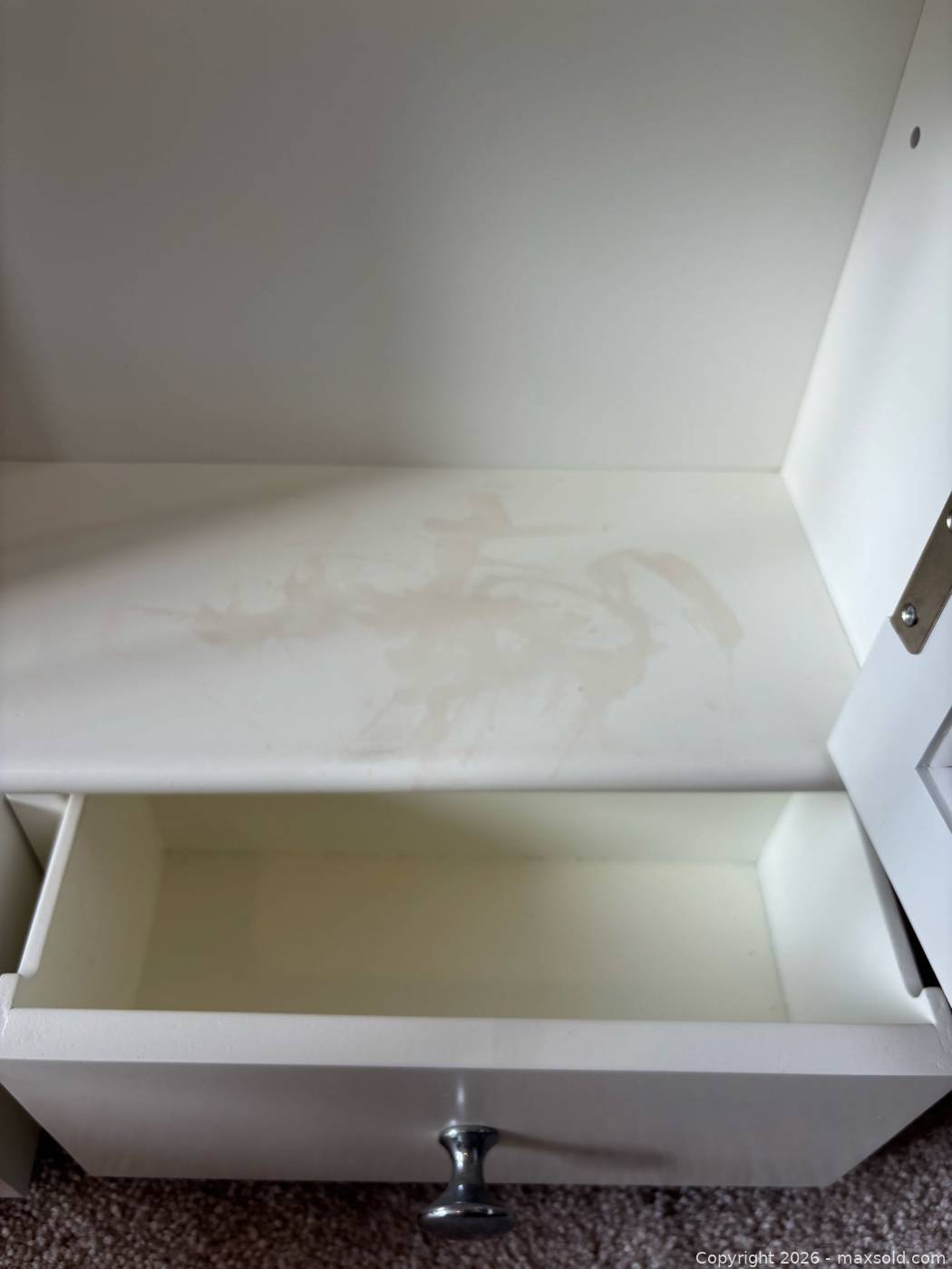 White bathroom cabinet & Danze scale | Maxsold