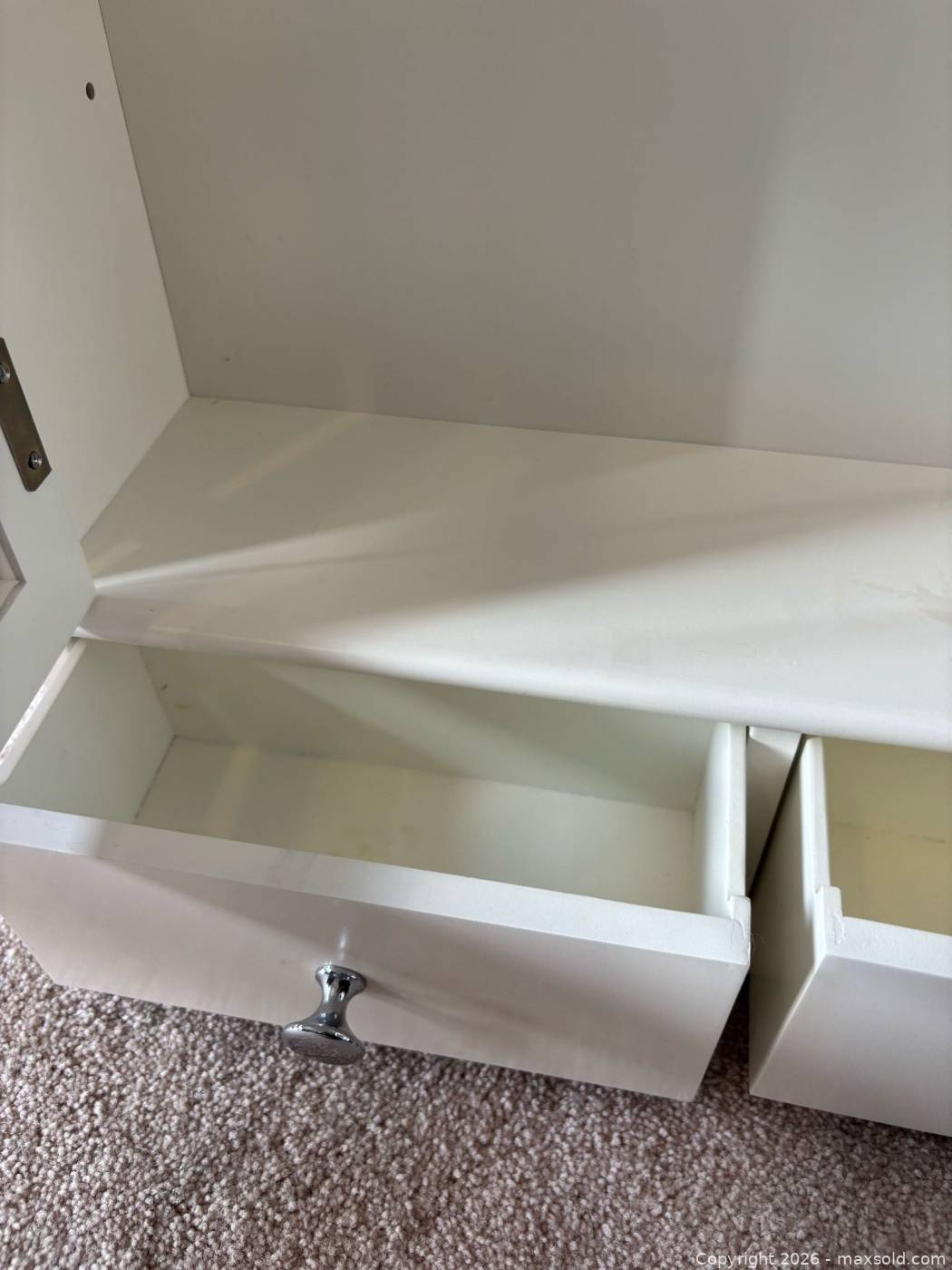 White bathroom cabinet & Danze scale | Maxsold