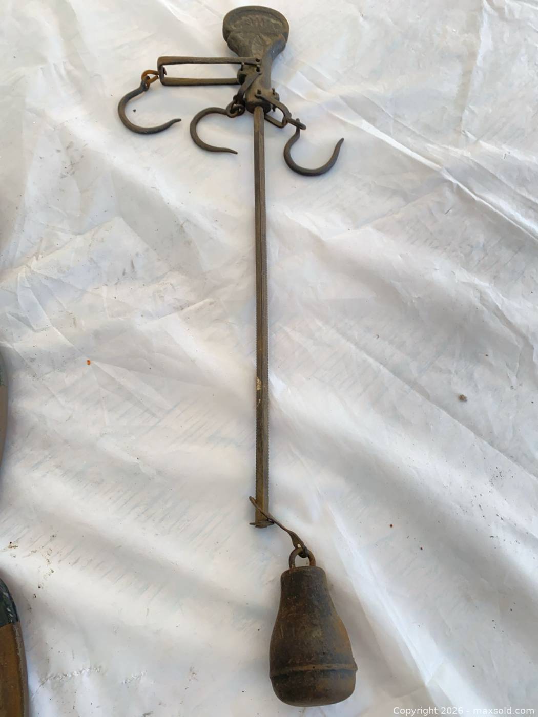 Vintage cast iron scale, clamps, bells | Maxsold