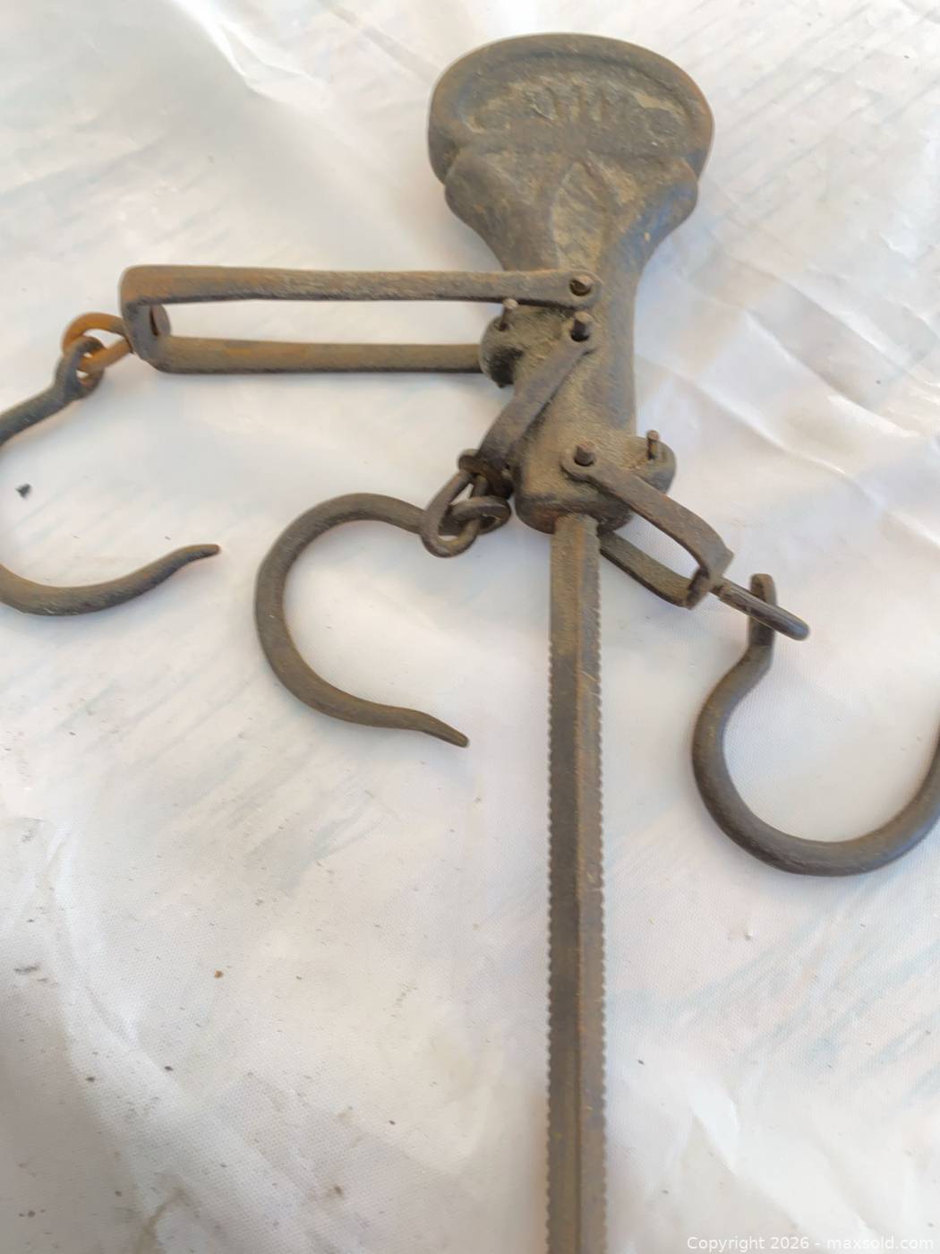 Vintage cast iron scale, clamps, bells | Maxsold