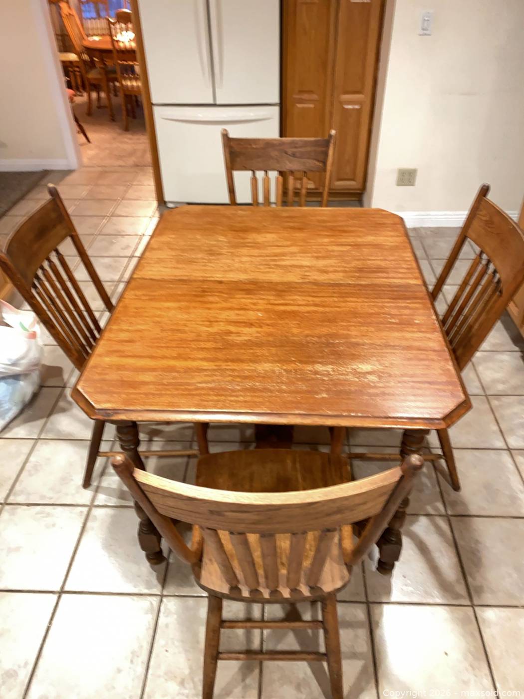 Vintage wooden dining table with four Windsor chairs | Maxsold