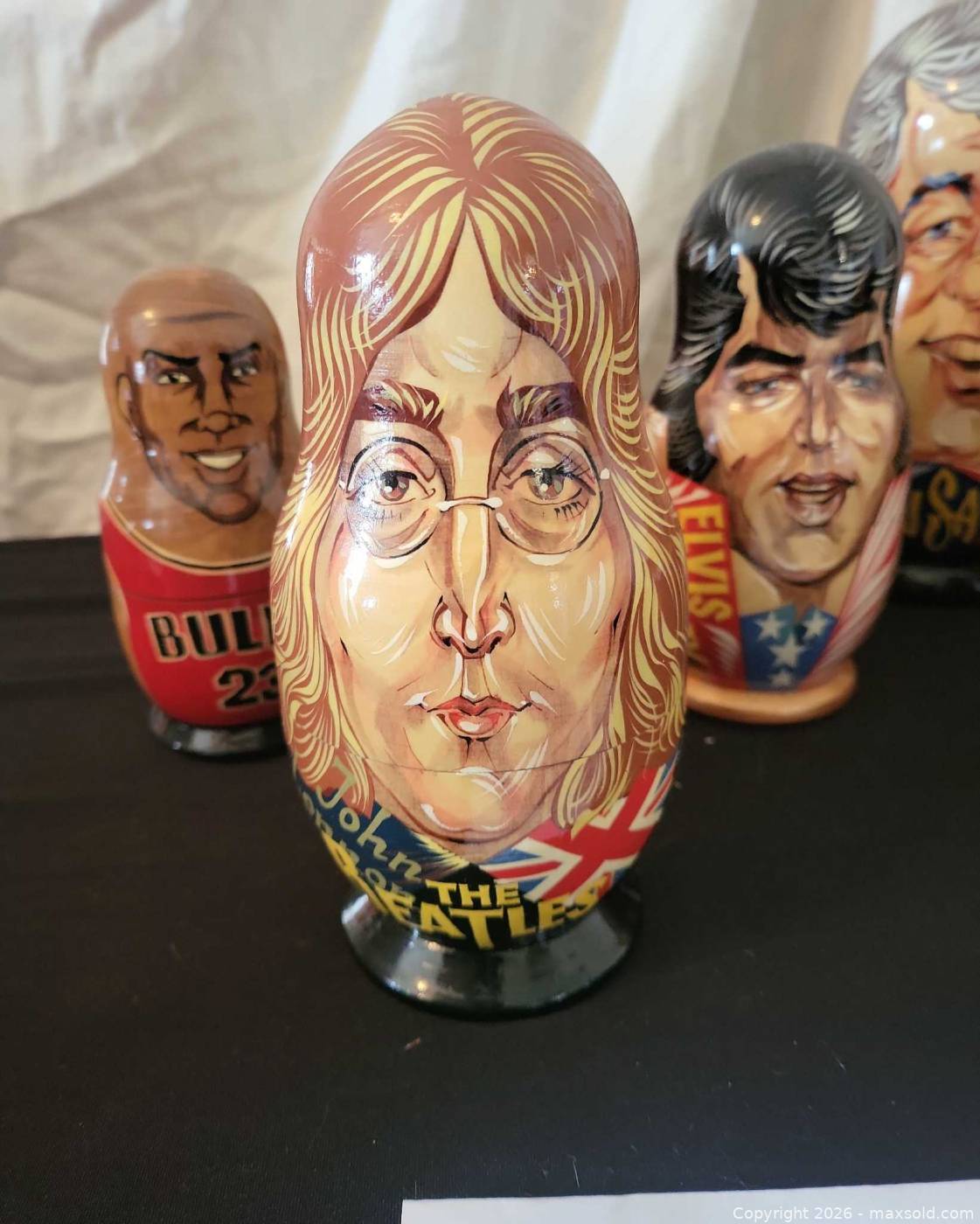 7 wooden caricature nesting dolls | Maxsold