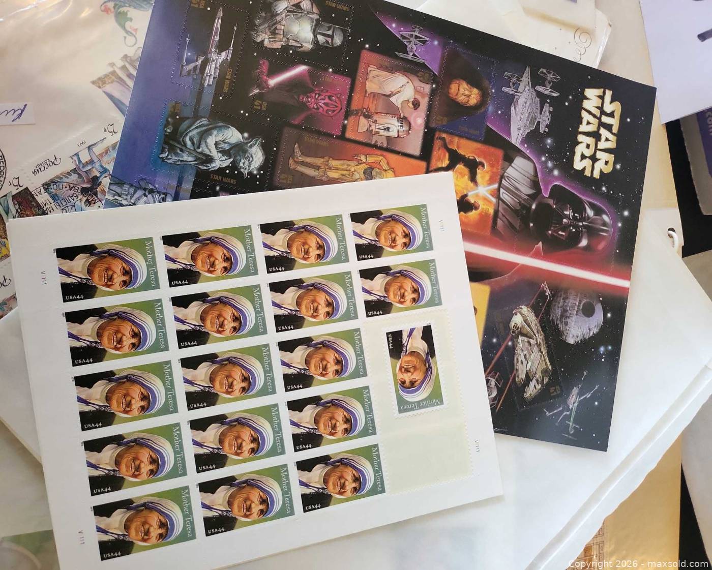 Box lot USPS mint postage sheets and album pages | Maxsold