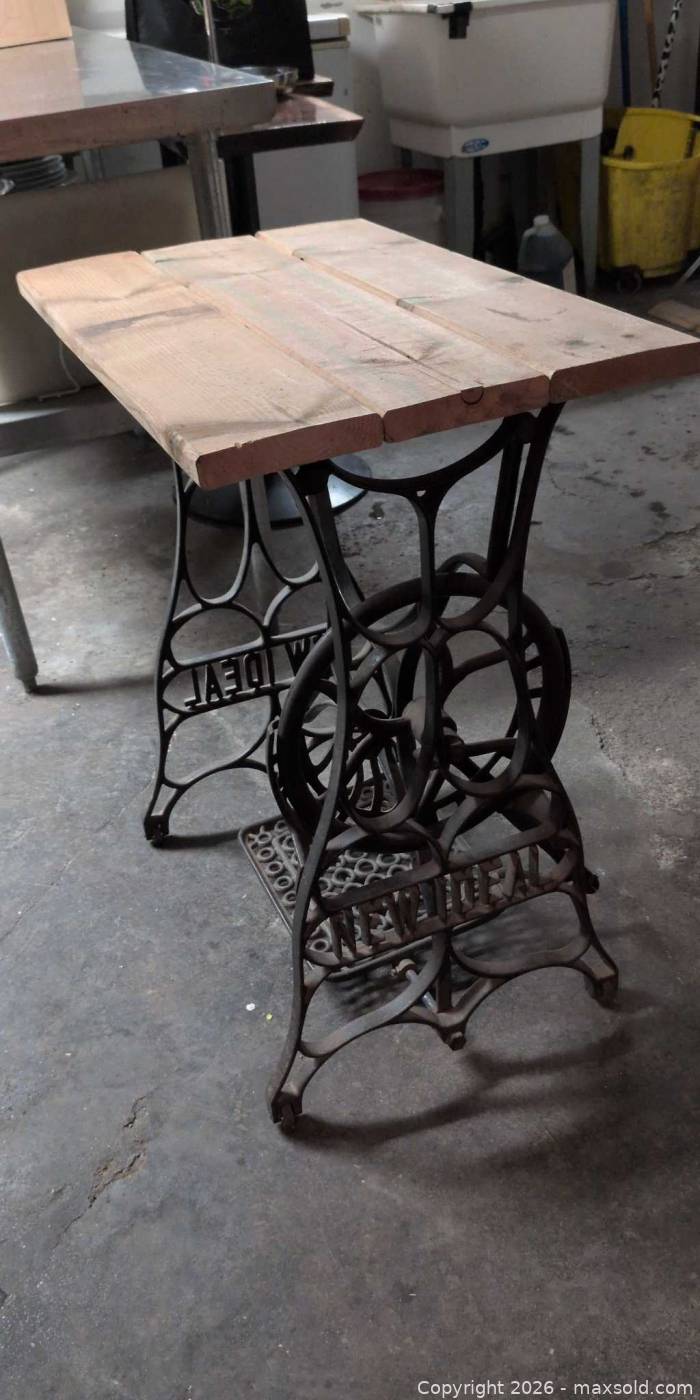 New Ideal cast iron sewing machine table | Maxsold