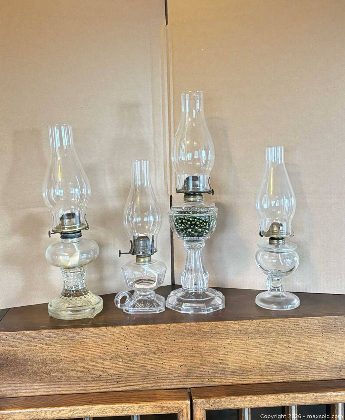 4 clear glass oil hurricane lamps | Maxsold