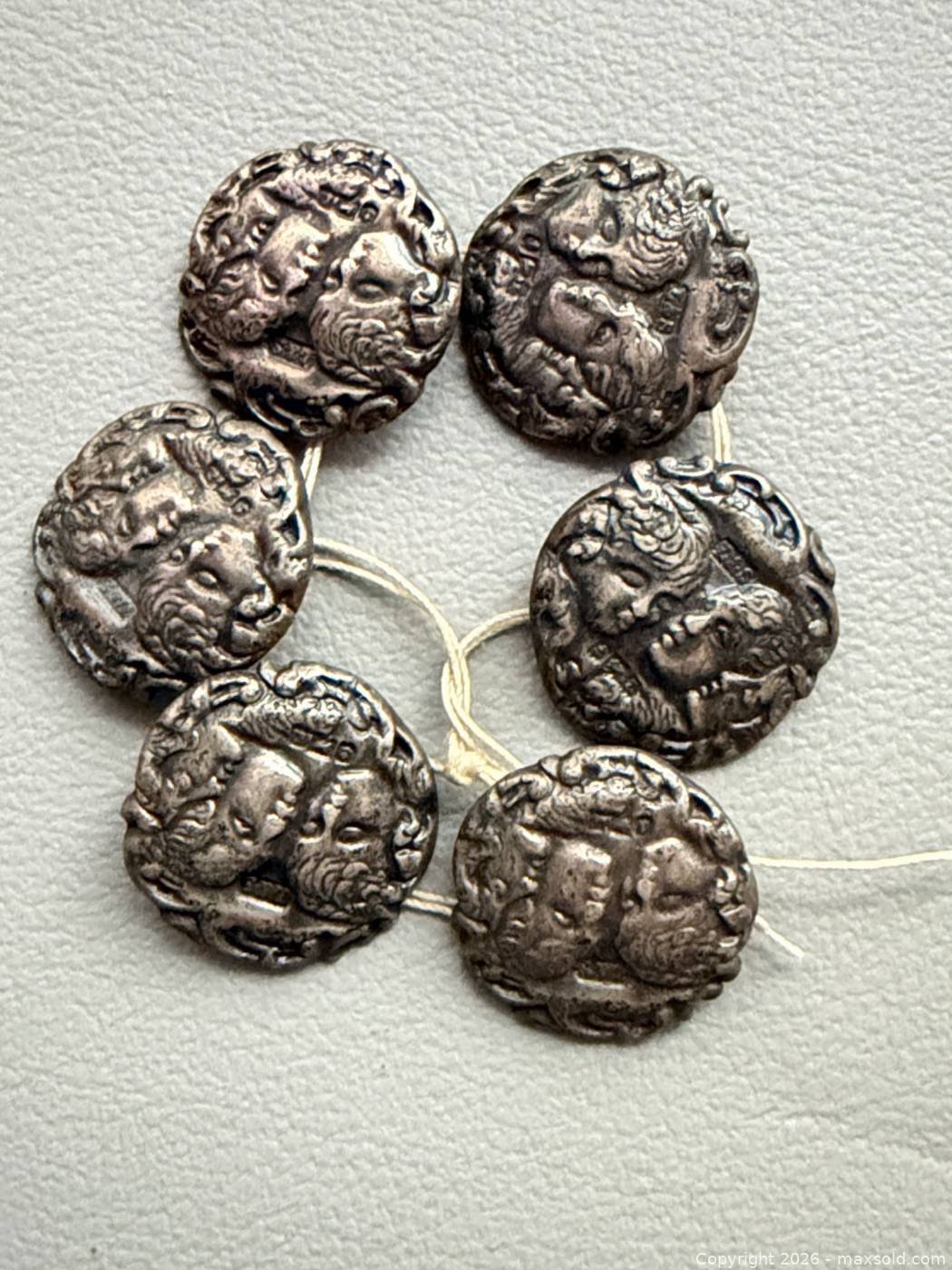 6 hallmarked Edwardian silver cherub buttons | Maxsold