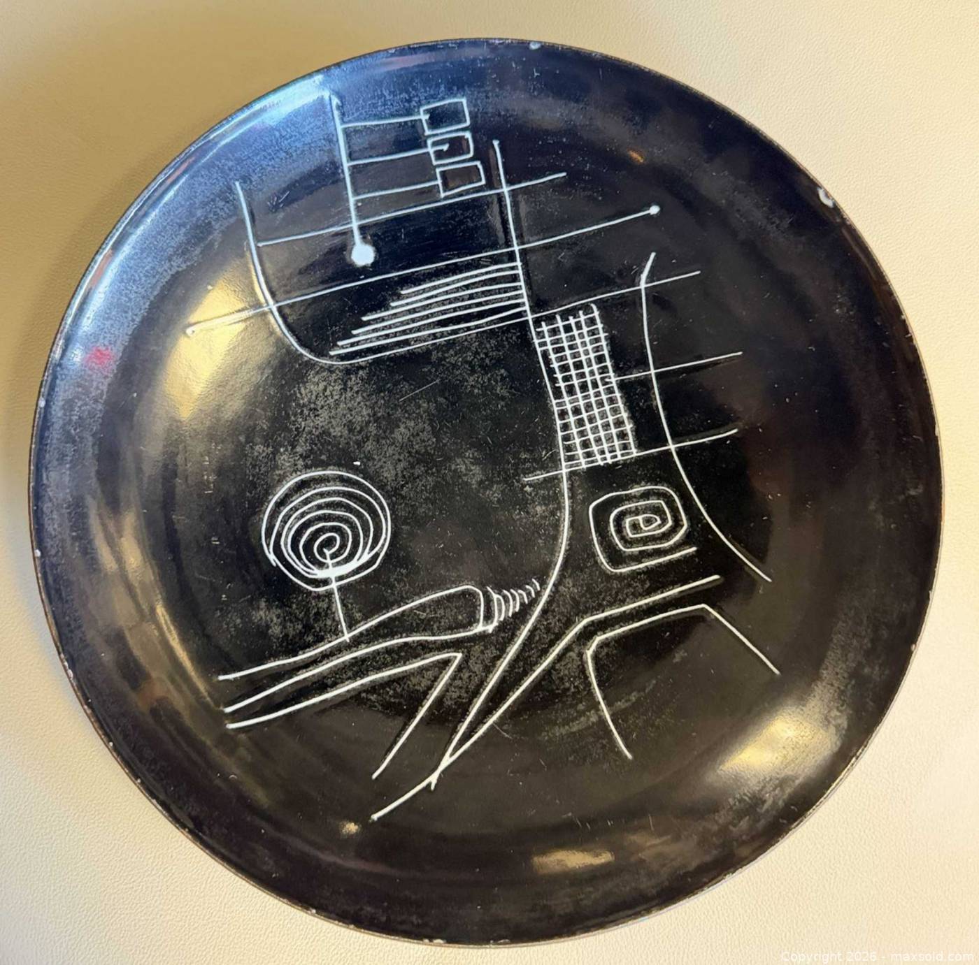 Modernist Black Metal Decorative Plate | Maxsold