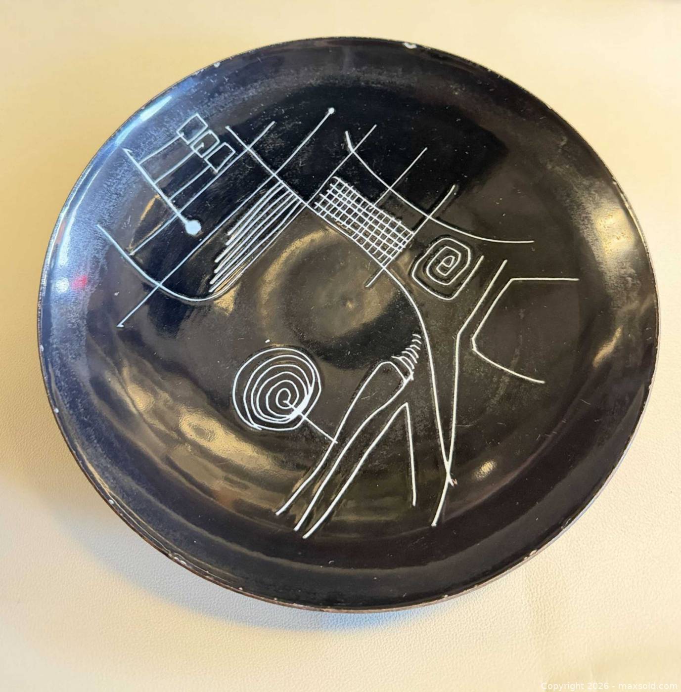 Modernist Black Metal Decorative Plate | Maxsold