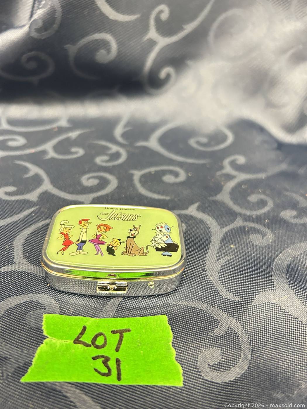 The Jetsons metal pill box | Maxsold