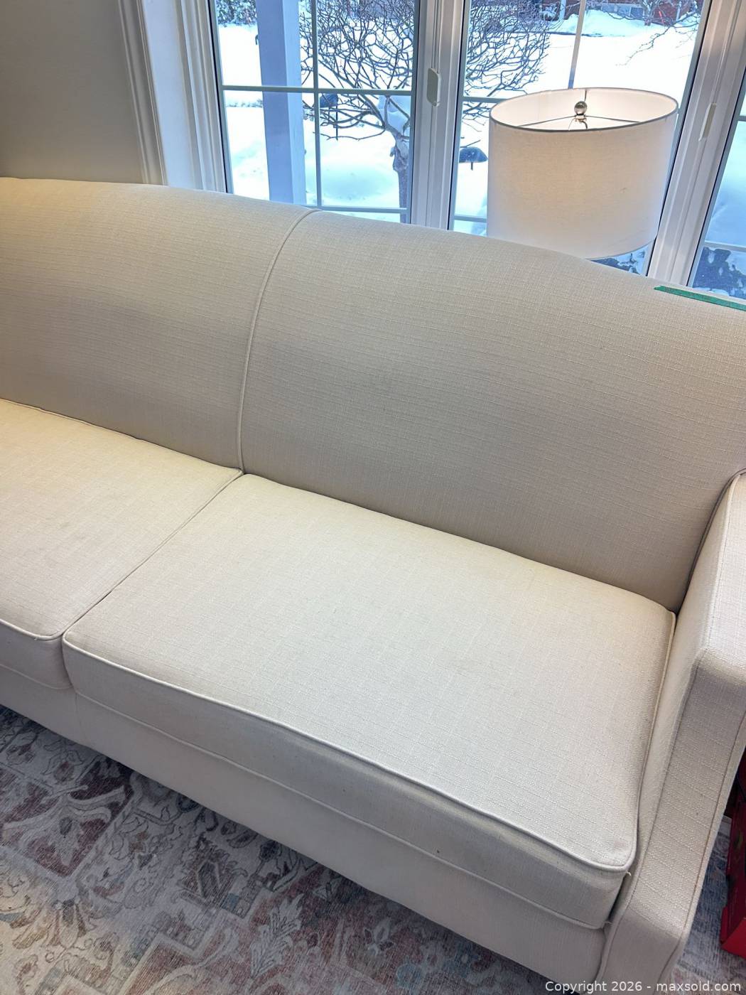 Ivory three-seat sofa 80in x 33in x 34in | Maxsold