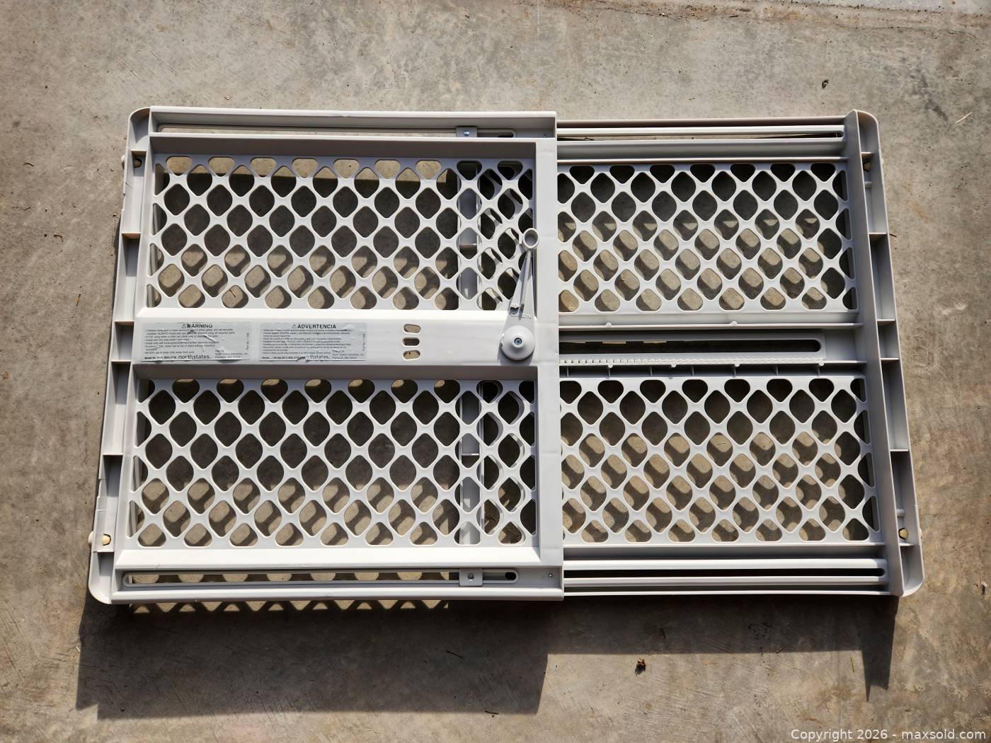 Adjustable plastic stair safety gate | Maxsold