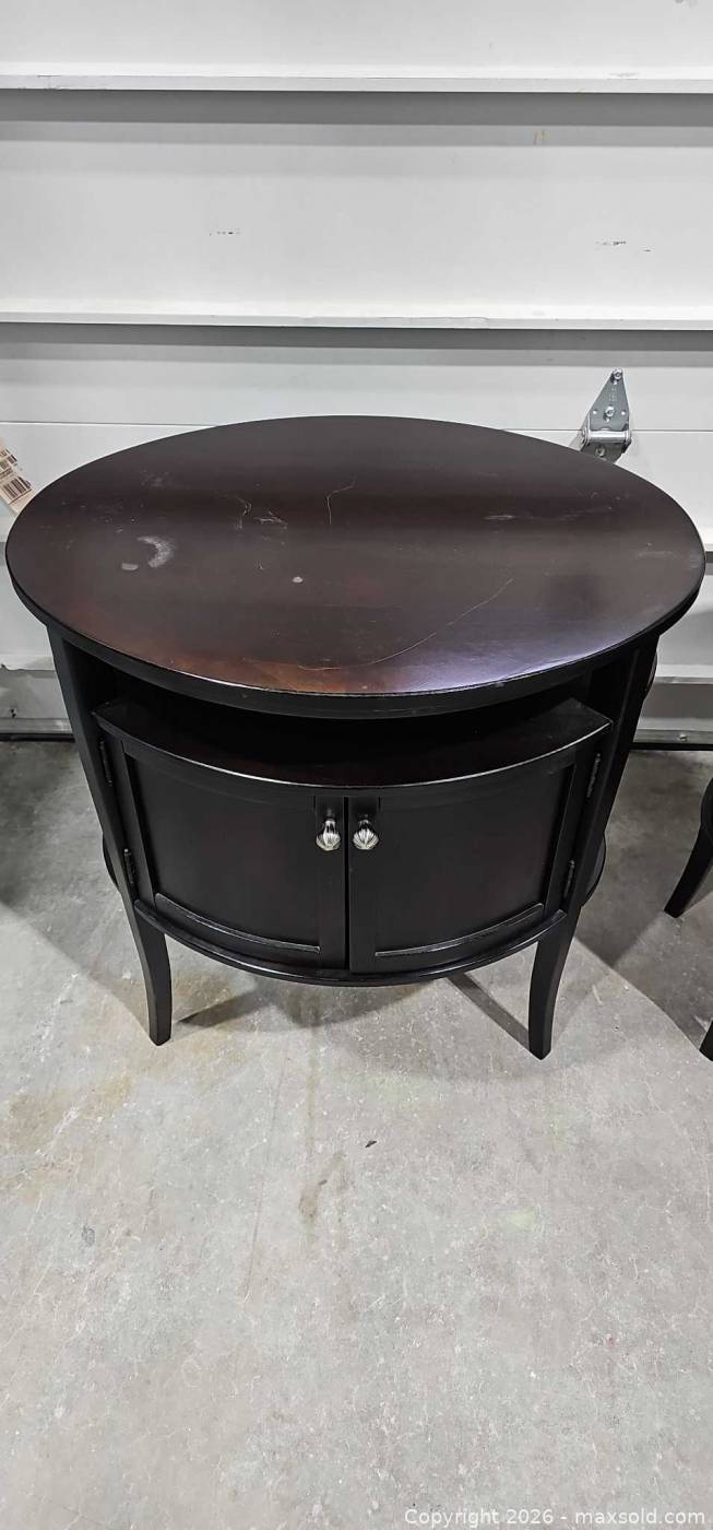 Pair dark brown oval end tables with cabinet | Maxsold
