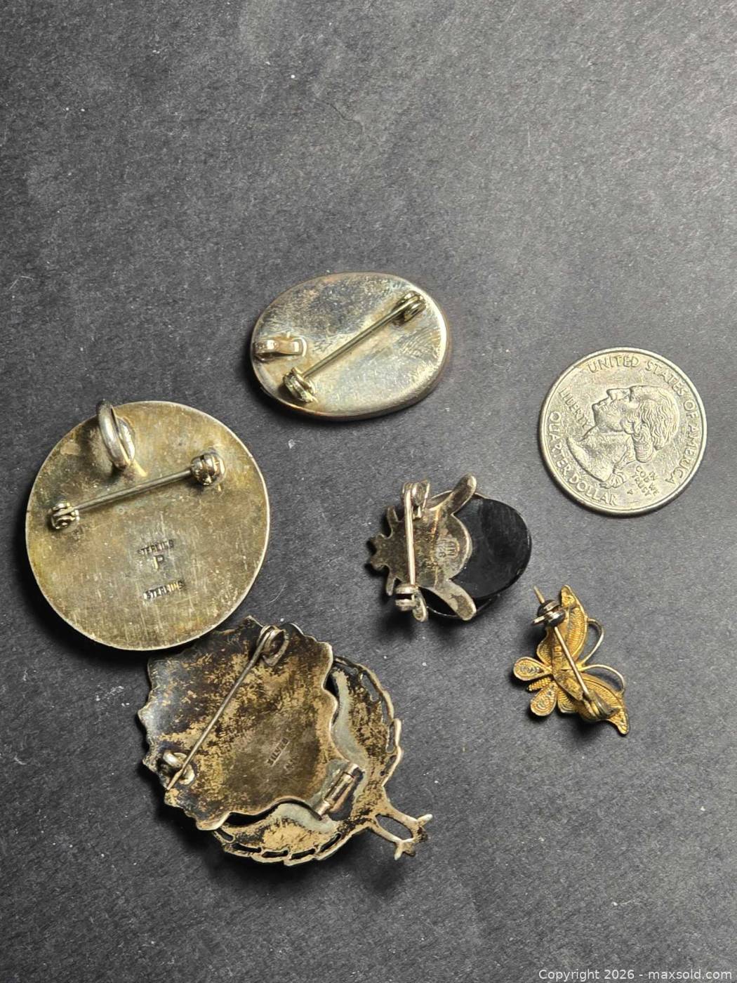Sterling silver brooches and pins, 34 g | Maxsold