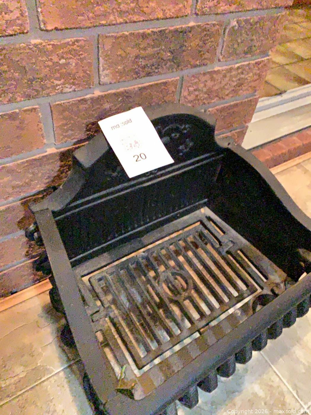 Antique cast iron fireplace grate | Maxsold