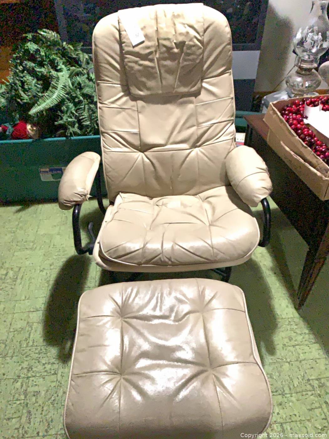 Beige leather swivel chair with ottoman | Maxsold