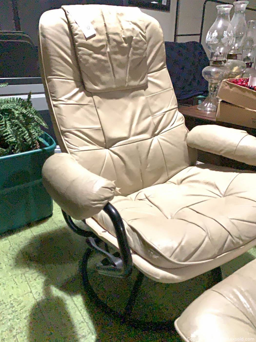 Beige leather swivel chair with ottoman | Maxsold