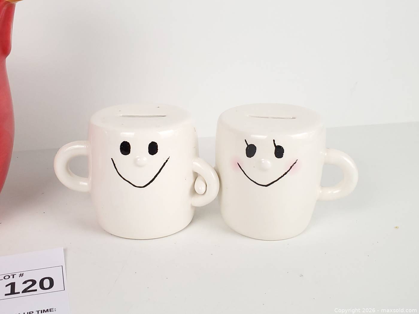 La Dolce Vita red polka-dot hen + 2 smile coin banks | Maxsold