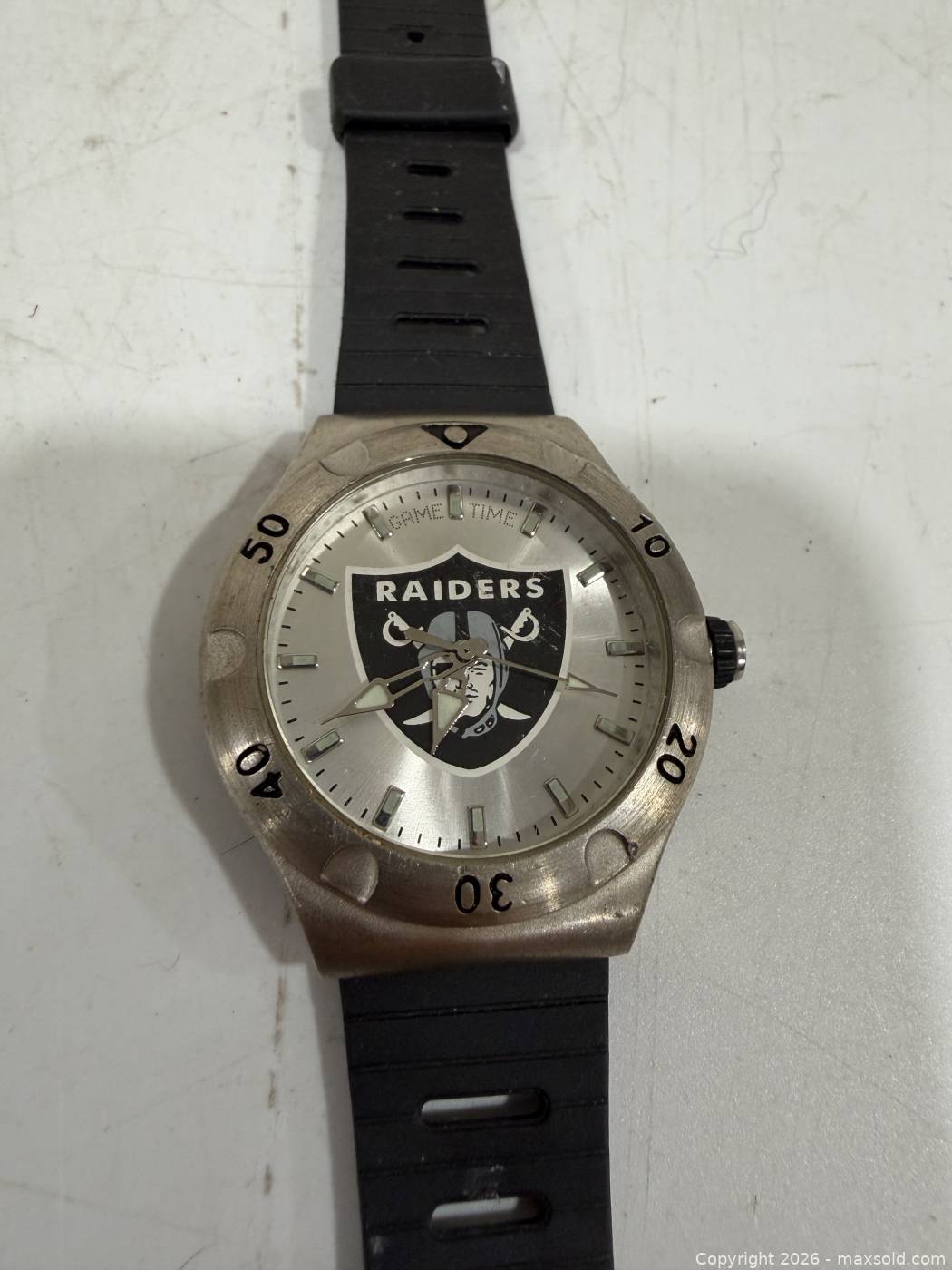 Vintage pocket lighters, flask, Raiders watch, matches, accessories ...