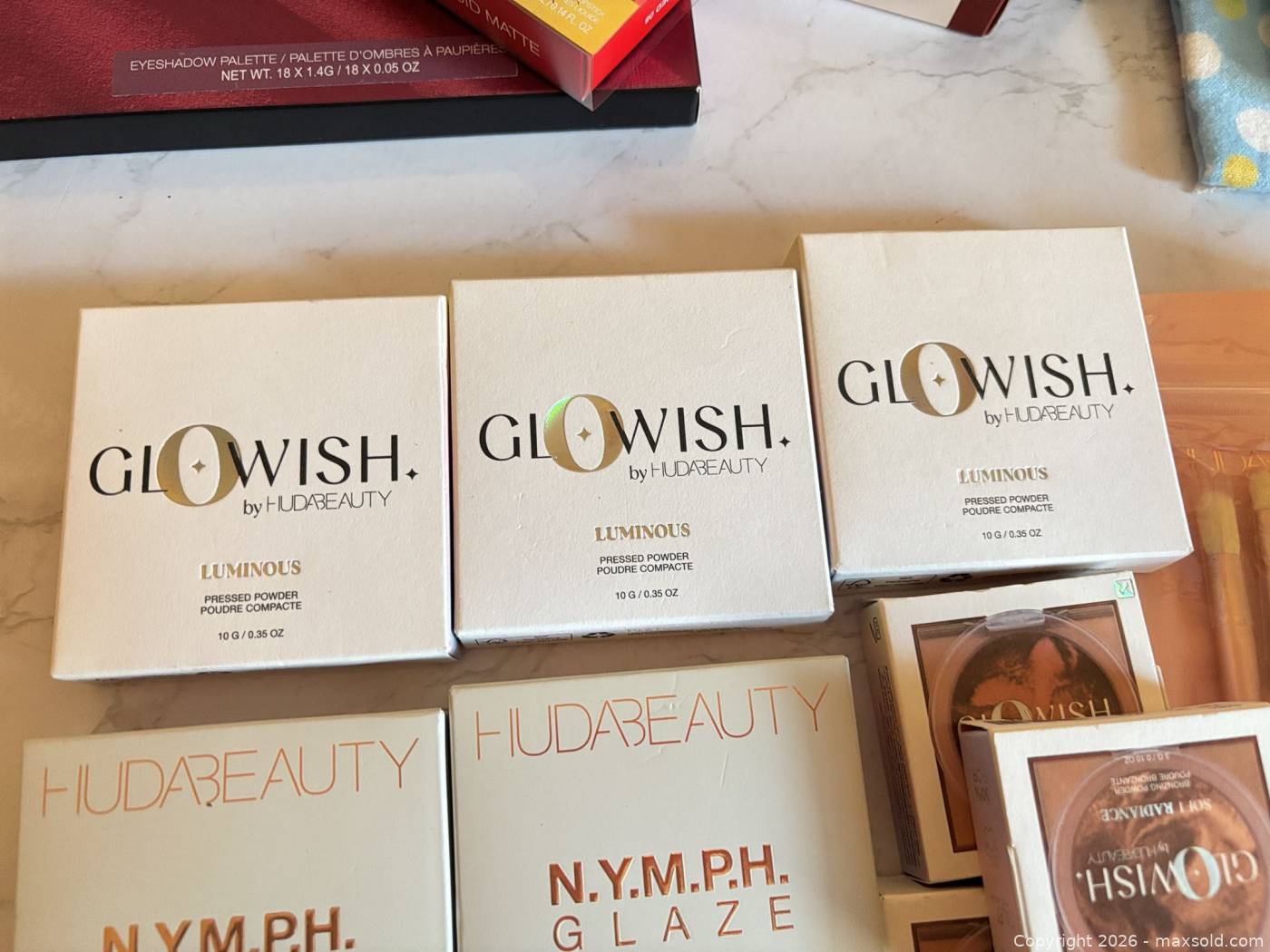 Huda Beauty Glowish powders, bronzers, N.Y.M.P.H. highlighters, brush ...