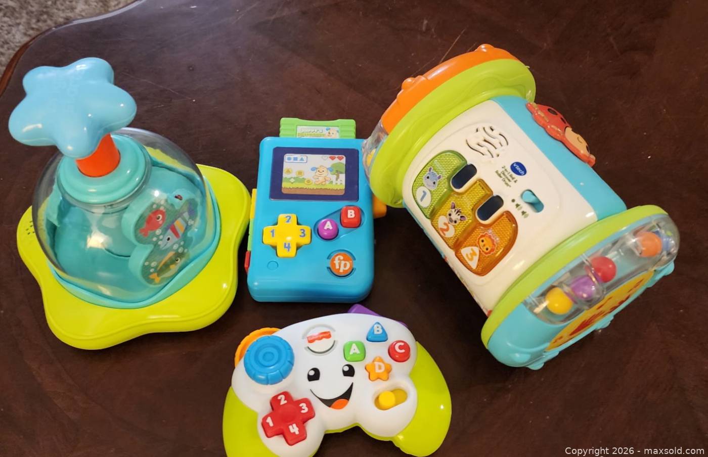 4 multicolor electronic baby activity toys | Maxsold