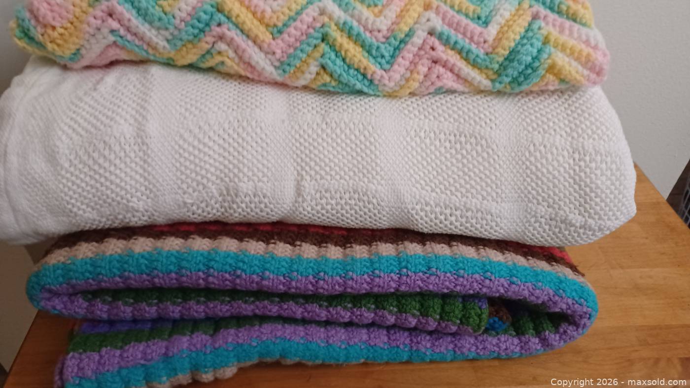 Stack of 3 crocheted and knitted throw blankets | Maxsold