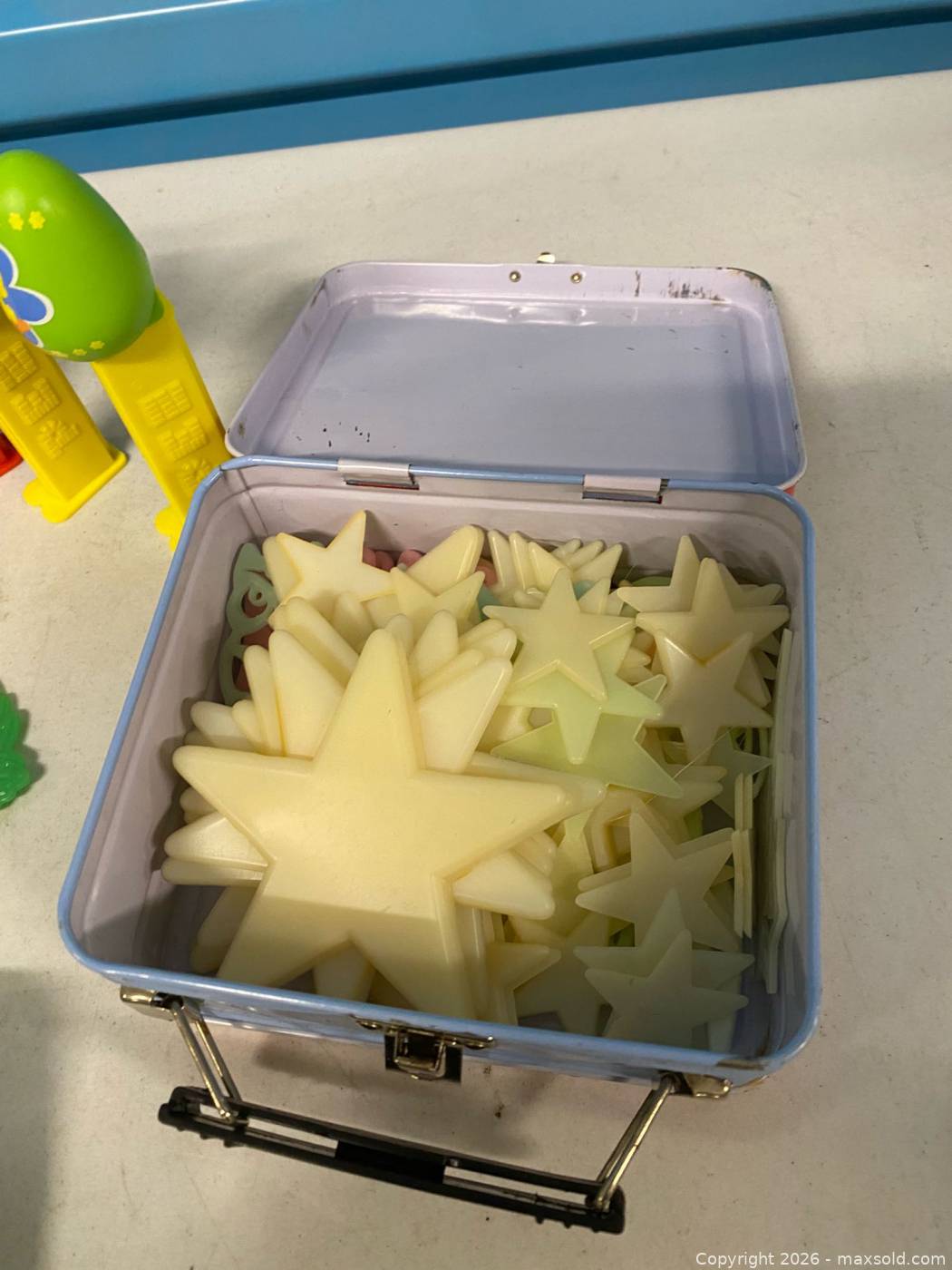 Pez dispensers, glow stars, Barbie pouch | Maxsold