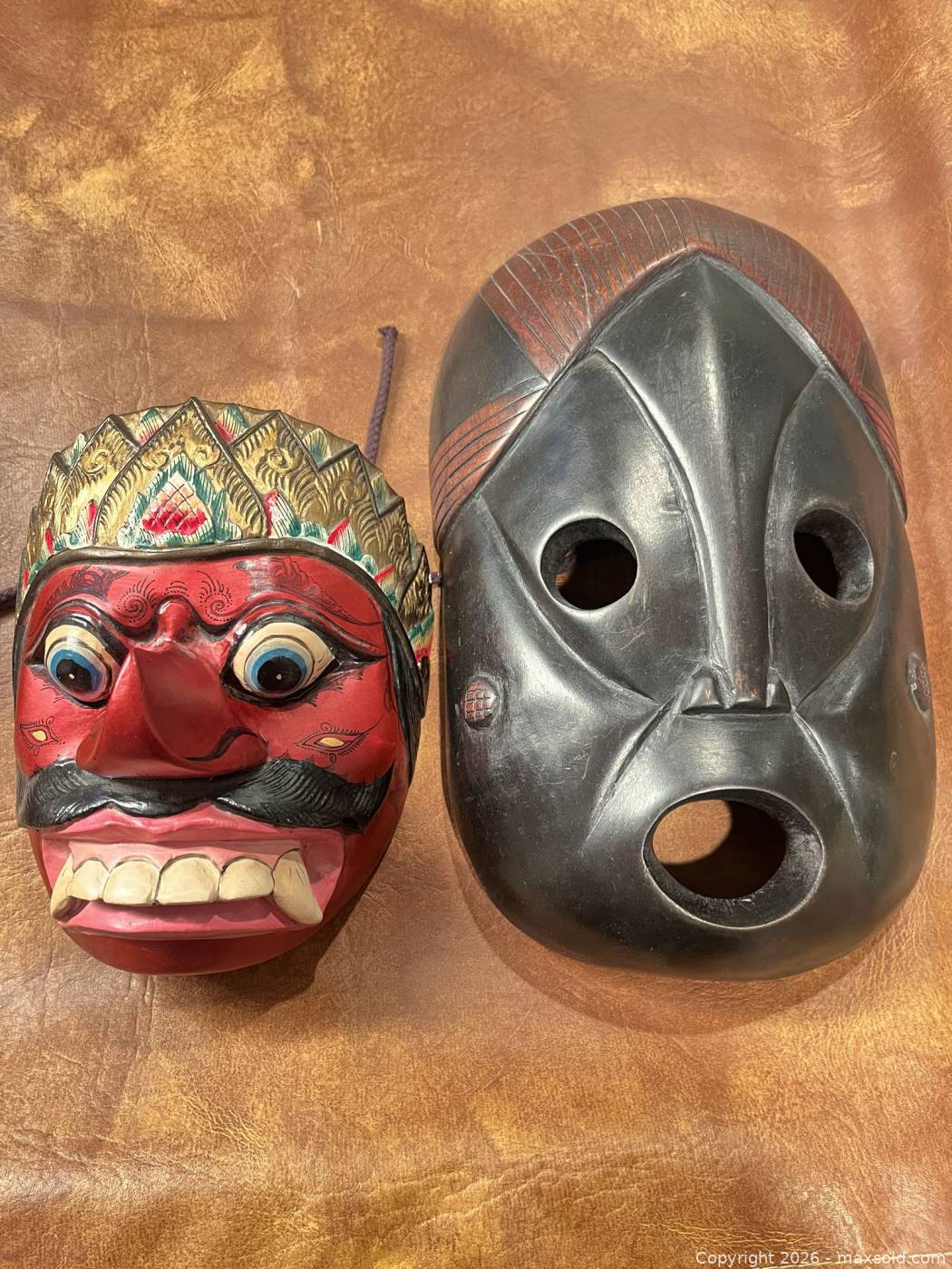 Four Hand-Carved Wooden Masks | Maxsold